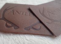 China Custom Embossed Genuine Leather Patches Tan Color for Jeans 100pcs MOQ for sale