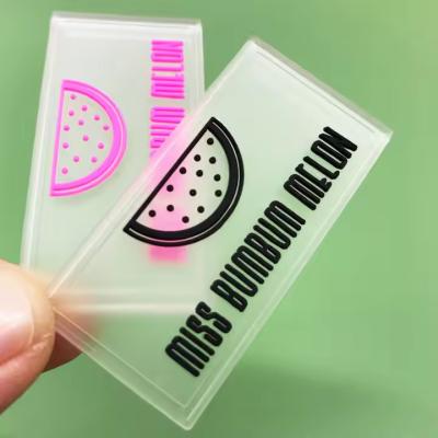 China Custom Transparent PVC Rubber Patch Clear Silicone Label for Garment 2-3 Color Logo for sale