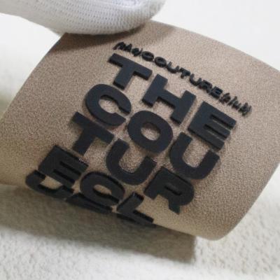 China Custom Foamed Silicone Print Label on Microfiber 3D Embossed Brand Tag for Luxury Apparel 4.5x2.5cm for sale