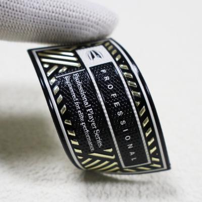 China Custom TPU High-Frequency Patch 4.5x2.5cm Metallic Gold Black Player Badge for Sportswear for sale