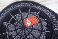 China Custom Embroidered Patches Washable Black Polyester Adhesive 3D Logo Badge for sale