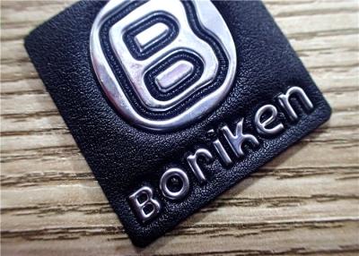 China Black Embossed Leather Patches with Silver TPU Logo - 5000pcs Daily Capacity, 500pcs MOQ for Bags and Garments for sale