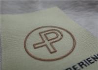 China Shiny Gold 0.4mm Thickness Mid Fold Woven Clothing Labels for Garment Logo for sale