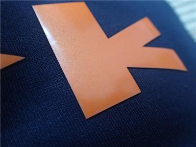 China Custom Shiny Orange TPU Iron On Clothing Patches Heat Transfer Shoe Label 140-150C for sale
