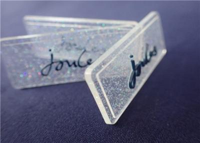 China Custom Fully Transparent PVC Badge 4x1.8cm with Colorful Powder for Garment Labels for sale