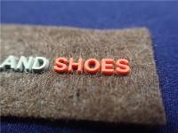 China Custom Non-Woven Garment Patch with 3D Injection Molding Double Color Logo 500 Pcs MOQ for sale