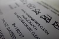 China Custom Screen Printing Nylon Care Labels 50mm Flat Cutting for Bags Towels for sale