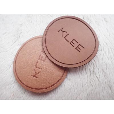 China Custom PU Leather Patch Label Debossed Foldable for Clothing Handbags Jeans 100 Pcs for sale