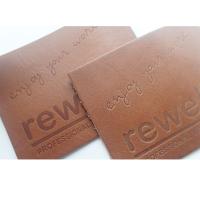 China Custom Embossed Logo Genuine Leather Patches for Clothing Hats 100 PCS for sale