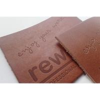 China Custom Embossed Logo Genuine Leather Patches for Clothing Hats 100 PCS for sale
