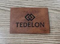 China Custom Embossed Logo PU Leather Patches Sew On Clothing 100 Pcs Min Order for sale