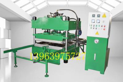 China Rubber Tiles Vulcanizing Press with 4 Working Layers 550X550mm Platen Size and Manual Push-Out Device for sale