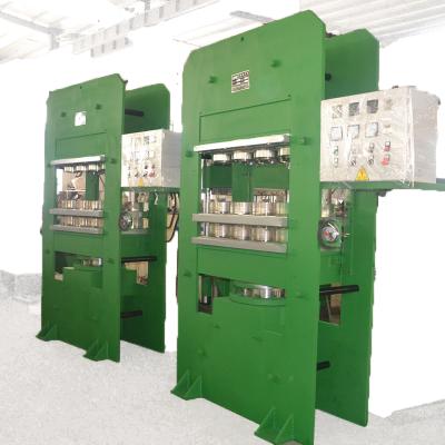 China Hydraulic Rubber Vulcanizing Machine with 200 Tons Total Pressure PLC Automatic Control and Electric Heating for sale