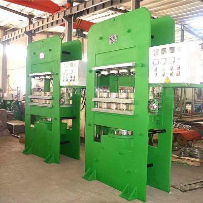 China Hydraulic Rubber Vulcanizing Machine with 200 Tons Total Pressure PLC Automatic Control and Electric Heating for sale