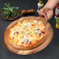 China Round Serving Acacia Wood Cutting Board With Handle for sale