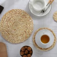 China Natural Water Hyacinth Round Braided Placemats 25cm Heat Resistant Woven Table Mats for sale