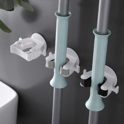 China Self Adhesive Mop Broom Holder Wall Mount Gripper 7x5.5cm ABS Non-Slip Organizer for sale