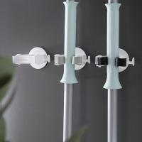China Self Adhesive Mop Broom Holder Wall Mount Gripper 7x5.5cm ABS Non-Slip Organizer for sale