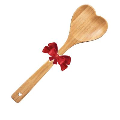 China Engraved Heart Shaped Bamboo Spoon 30cm Cooking Utensil Non Stick Safe for sale