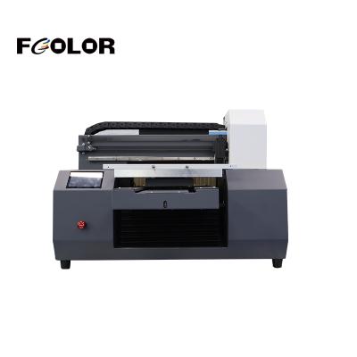 China Small Business 3040 Flatbed UV Printer for Sticker Pen Acrylic Leather Wood Glass Bottle for sale