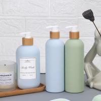 China HDPE Plastic Shampoo Bottle with Bamboo Lid - 500ml Soft Touch Empty Body Lotion Container for sale
