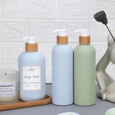 China HDPE Plastic Shampoo Bottle with Bamboo Lid - 500ml Soft Touch Empty Body Lotion Container for sale
