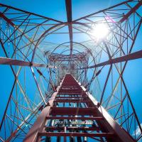 China 60M Heavy Duty Self Supporting Angle Steel Anti Corrosion 4 Legged Tower for Industrial Port Telecom Infrastructure for sale