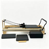 China Custom Rubber Wood Foldable Wooden Pilates Reformer Machine Full Track For Professional Studios for sale