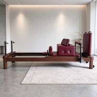 China Woodgrain Aluminum Pilates Reformer Machine Transformer 75kg Custom for sale