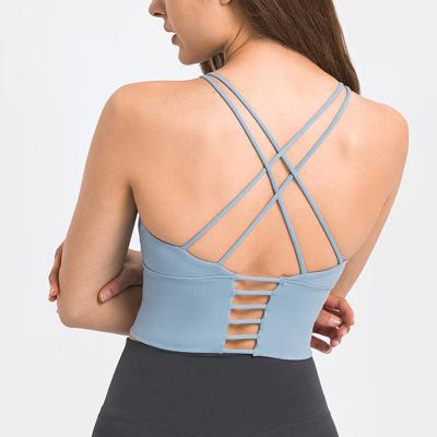 China Yoga Women's Strappy Sports Bras Criss Back Workout Padded Wireless Yoga Top for sale