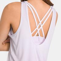China Active Stretch Ladies Yoga Tops One Piece Two Wear Cross Open Back Sport Bra With Removable Pad for sale