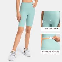 China Anti UV Ladies Yoga Sports Shorts Leggings Running Pants With Waistband Pocket for sale