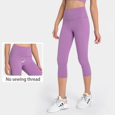 China 10 Colors High Waist Hip Lifting Pocket Yoga Sports Pants Nylon Nude Athletic Leggings for sale