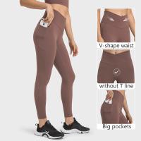 China Breathable Side Pocket Yoga Pants Elastic Ladies Cross Waist Sports Tights for sale