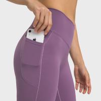 China Breathable Side Pocket Yoga Pants Elastic Ladies Cross Waist Sports Tights for sale