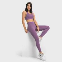 China Breathable Side Pocket Yoga Pants Elastic Ladies Cross Waist Sports Tights for sale