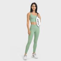 China Active Stretch Women Crop Tops Strappy Back Bulid In Widen Bottom Sports Bra for sale
