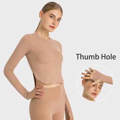 China Sexy Split Ladies Yoga Tops Workout Women Long Sleeve Shirts With Removable Pad for sale
