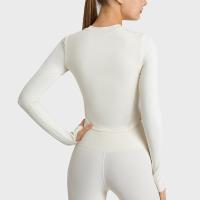 China Sexy Split Ladies Yoga Tops Workout Women Long Sleeve Shirts With Removable Pad for sale