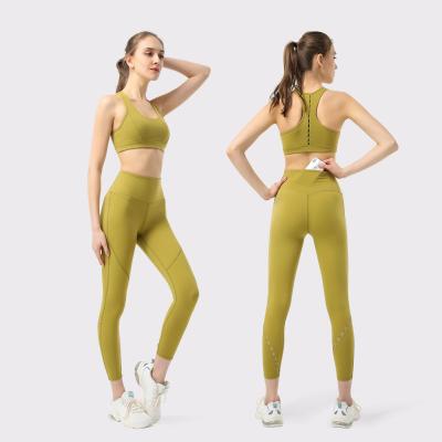 China Hollow Out Knot Yoga Set Clothes Big Hidden Back Pocket Yoga Leggings Set for sale