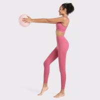 China Solid Color Women's 2 Piece Yoga Set Sexy Cross Back Bra Sports Clothes Yoga Leggings for sale