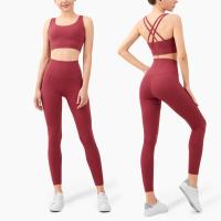 China Cross Back Yoga Set Clothes Gathered Belly Matching Sports Bra And Leggings Set for sale
