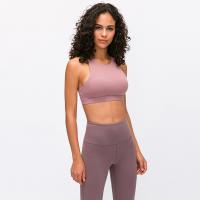 China Padded Yoga Moisture Wicking Shockproof Bra Cross Back Round Neck Sports Bra for sale
