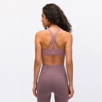 China Padded Yoga Moisture Wicking Shockproof Bra Cross Back Round Neck Sports Bra for sale