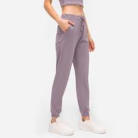 China Womens Stretch Workout Pocket Yoga Pants Straight Beam Foot for sale
