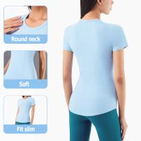 China Polyester Ladies Yoga Tops Naked Feeling Slim Short Sleeve Sports Tops for sale