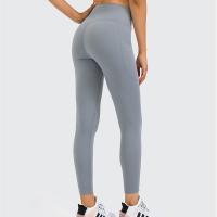 China Hip Lifting High Waisted Tights Pants Nylon Women's Yoga Pants With Side Pockets for sale
