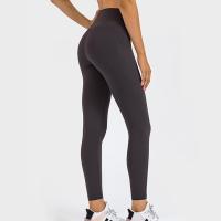 China Hip Lifting High Waisted Tights Pants Nylon Women's Yoga Pants With Side Pockets for sale