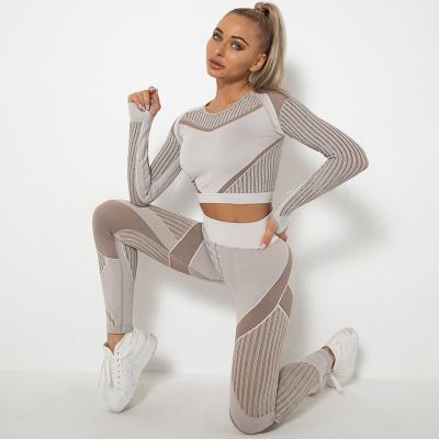 China Hygroscopic Womens Long Sleeve Gym Set Hollow Seamless Yoga Gym Set for sale