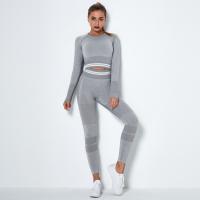 China Seamless Yoga Set Clothes Knitted Striped Quick Drying Yoga Leggings And Top Set for sale
